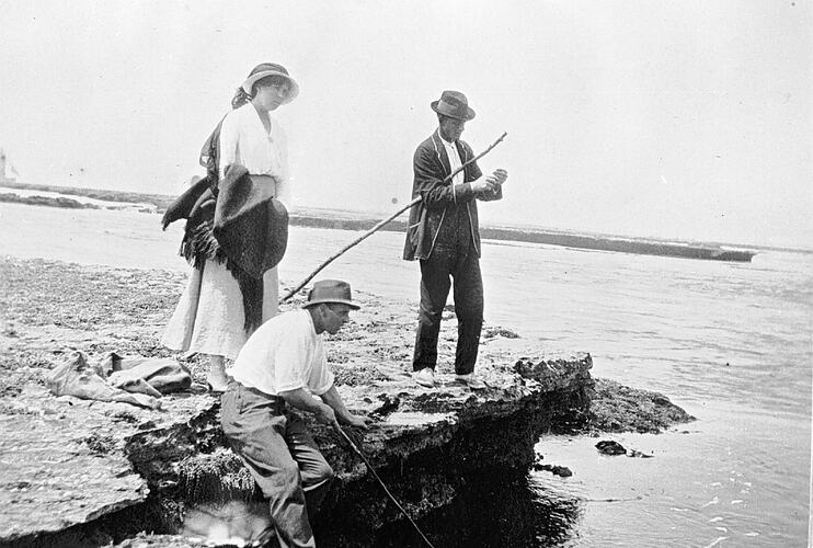 Negative - Woman & Two Men Fishing off the Rocks in Front of the ...
