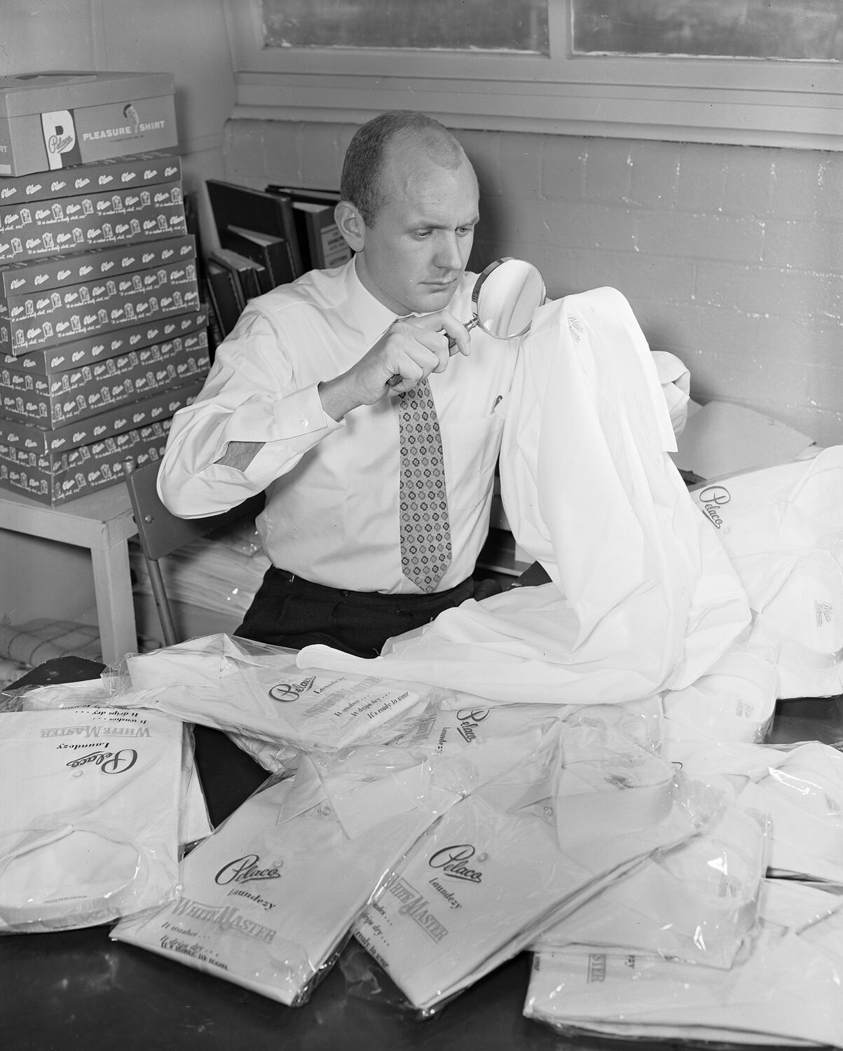 Negative - Pelaco Ltd, Man Inspecting Shirts, Richmond, Victoria, 1958