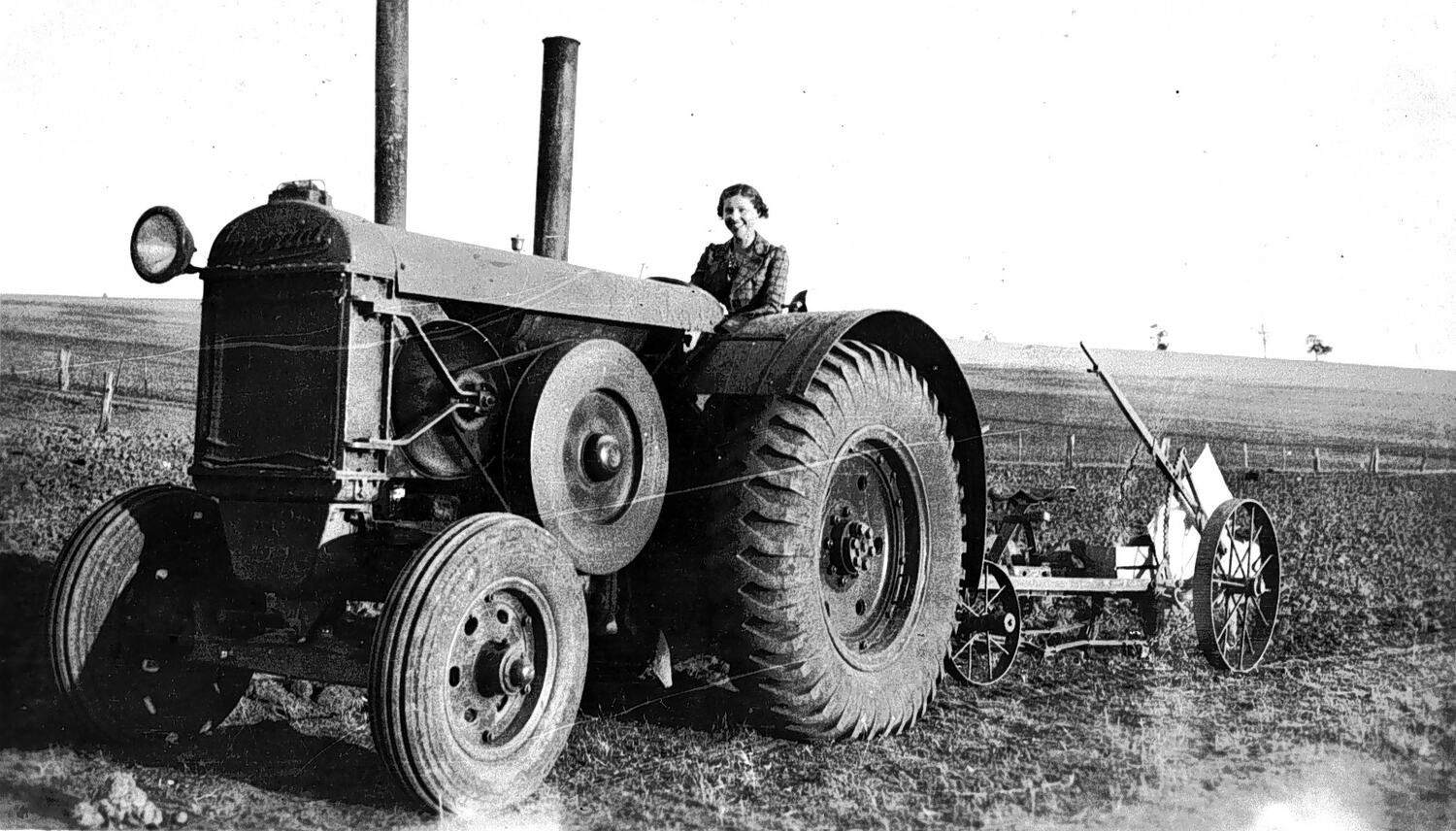 Negative - Woman Driving An A.H. McDonald Imperial Tractor, Victoria ...