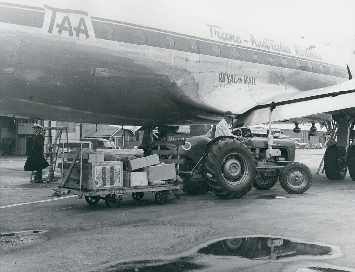 Photograph - TAA, Loading Cargo onto Aircraft, circa 1970