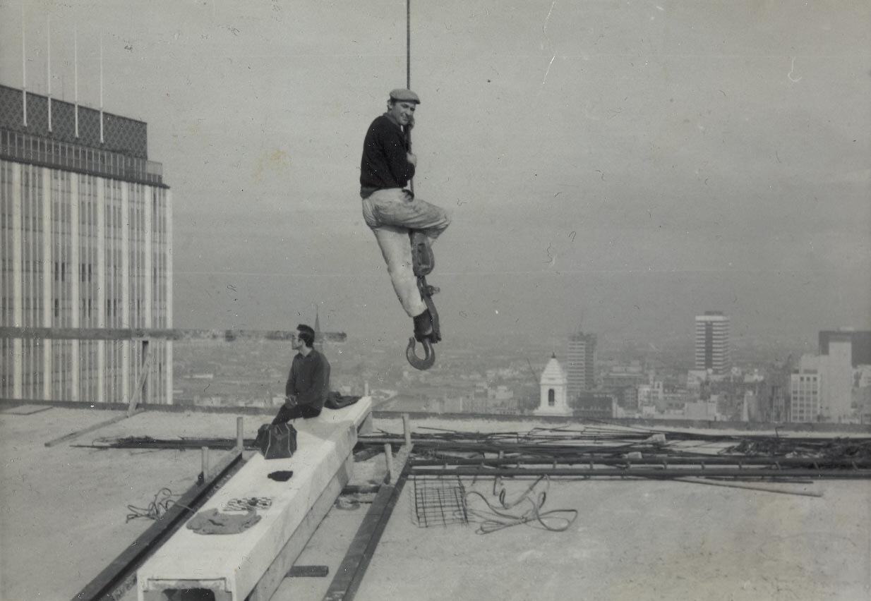 Digital Photograph - Man Swinging from Crane Hook, Reserve Bank ...