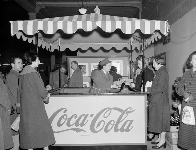 Negative - Coca-Cola, Worker in Promotional Stand, Victoria, Sep 1954
