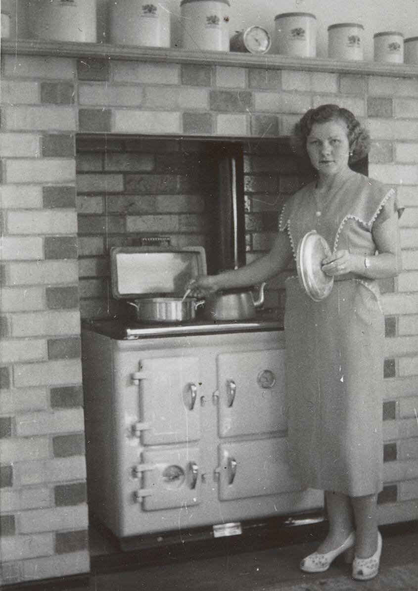 Digital Photograph - Woman with New Wood burning Stove, Kitchen, circa 1955