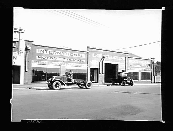 Negative - Motor Vehicles in Front of Garage, circa 1930s
