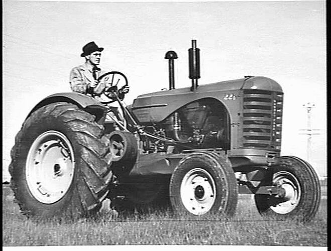 Photograph - H.V. McKay Massey Harris, Man Driving a 44 K Tractor in ...