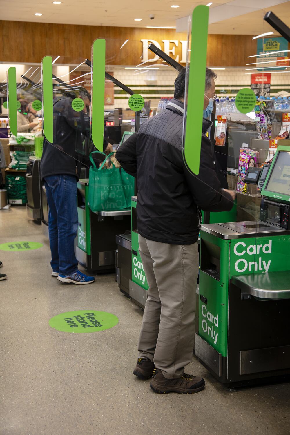 Digital Photograph - Customers Using Self-Serve Checkouts Behind Sneeze ...