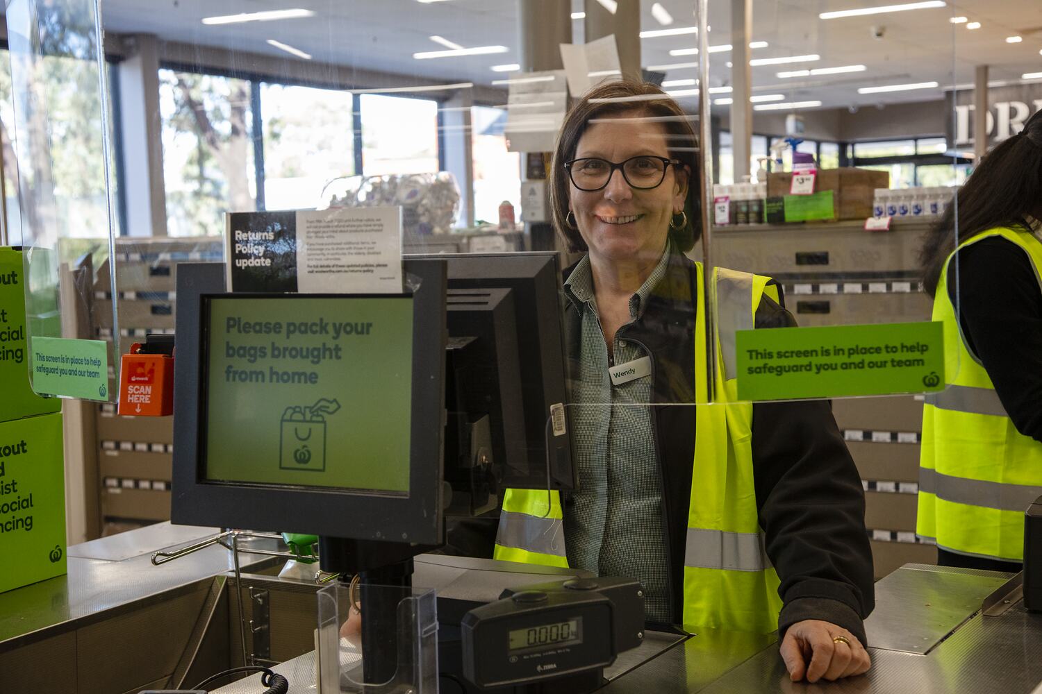 Digital Photograph - Checkout Cashier Behind Sneeze Screen, Woolworths ...