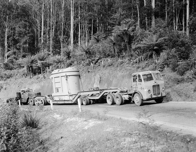 Negative - Two Yellow Express Trucks Transporting Equipment ...