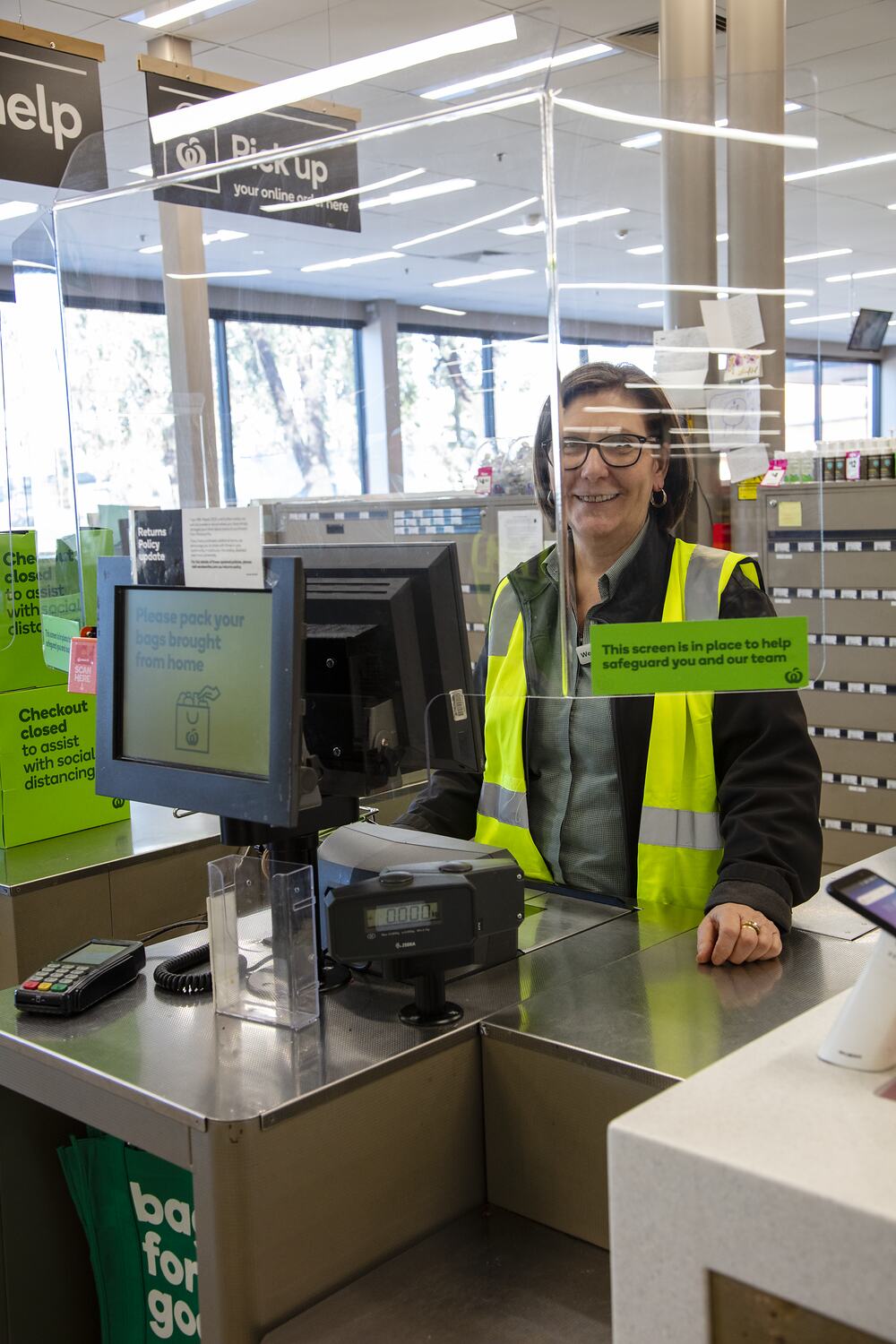 Digital Photograph - Checkout Cashier Behind Sneeze Screen, Woolworths ...